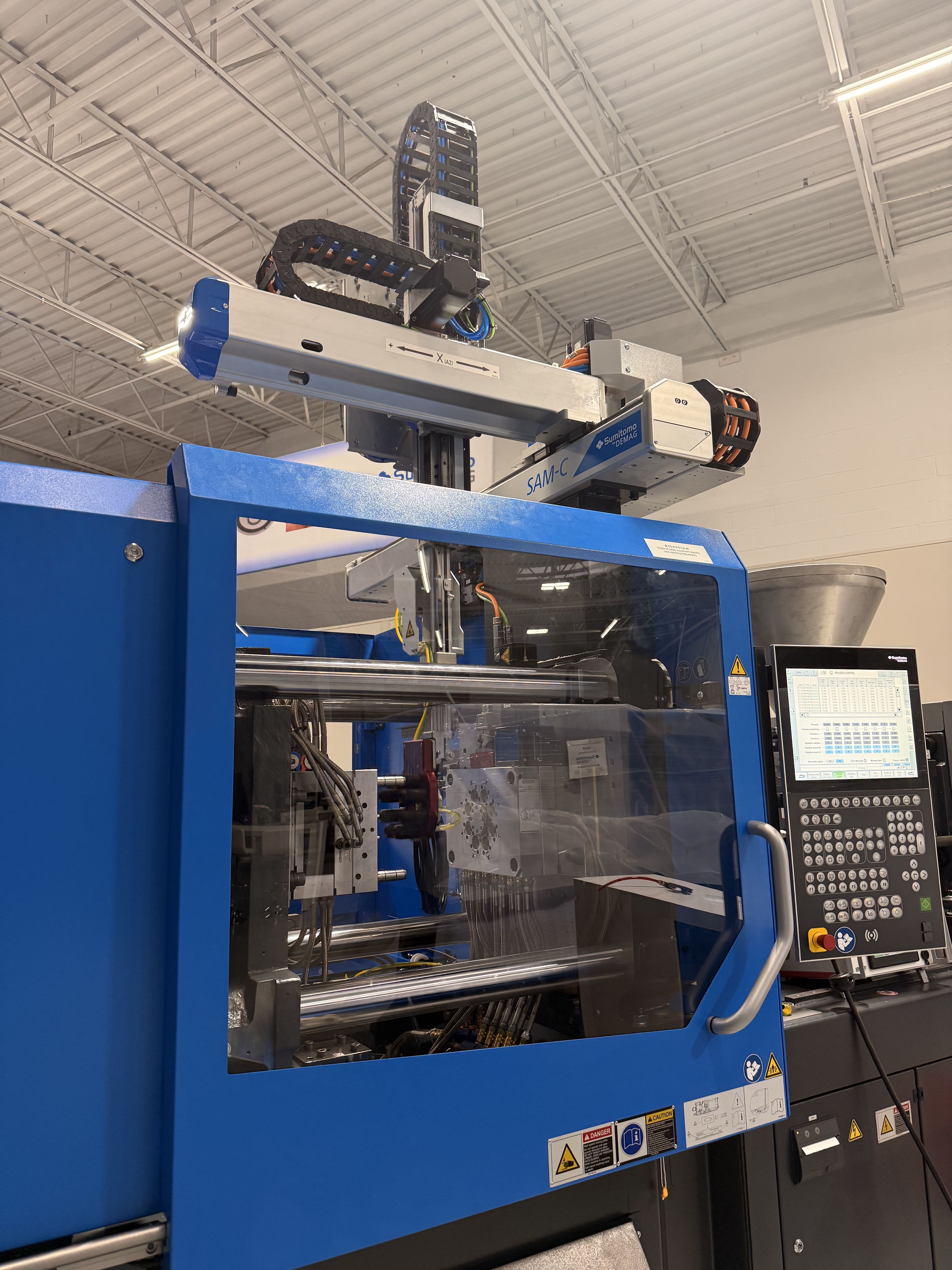 Machine builders show latest robots, medical tubing extrusion ...